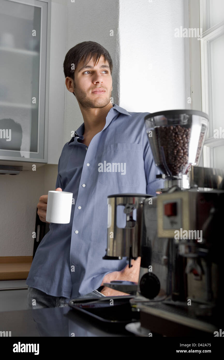 A man drinking his first cup of coffee for the day Stock Photo - Alamy