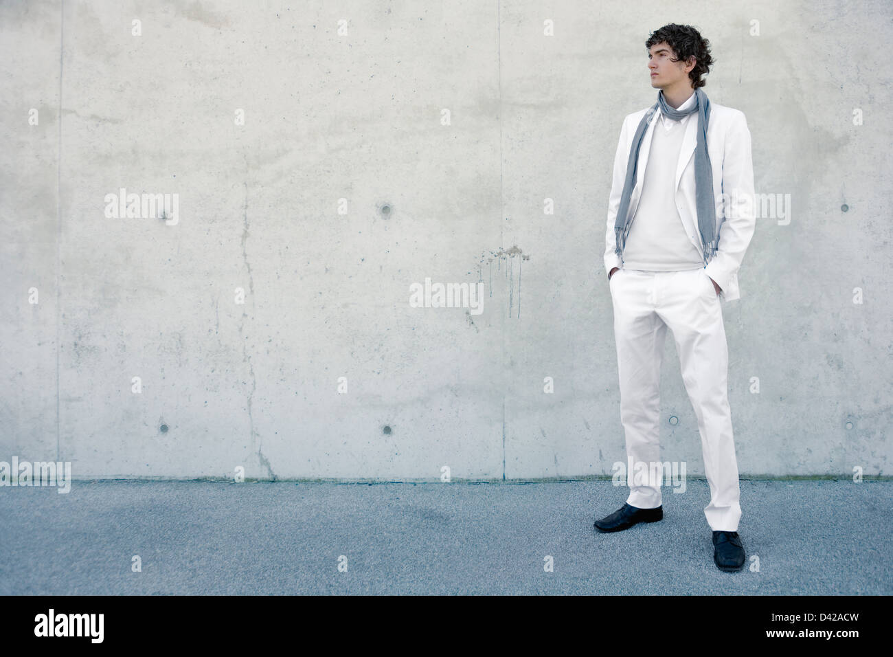 a young man wearing a fashionable light suit for spring and summer ...