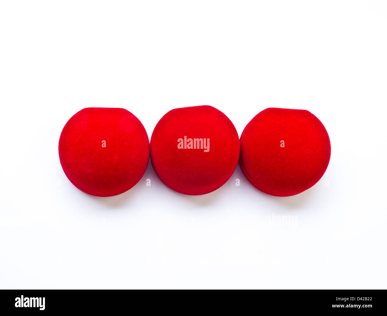Closed round red jewelry boxes isolated on white background Stock Photo ...