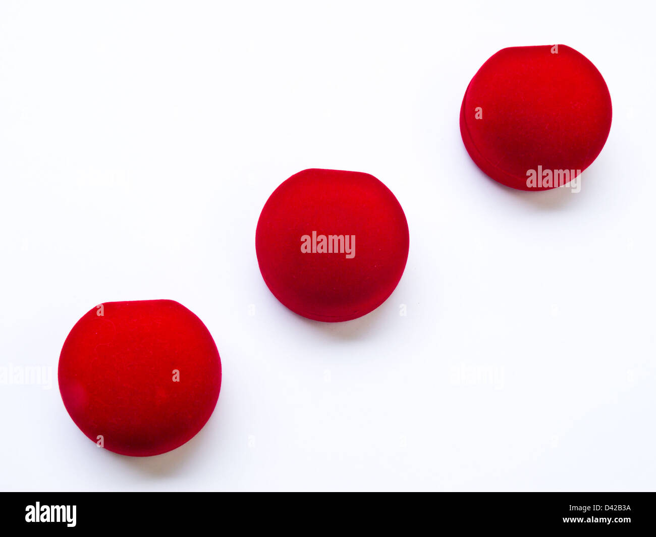 Closed round red jewelry boxes isolated on white background Stock Photo ...