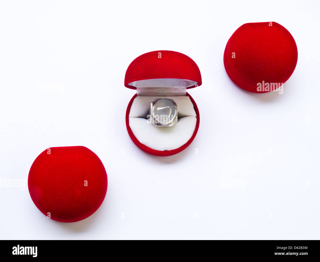 Opened round red jewelry boxes isolated on white background Stock Photo ...