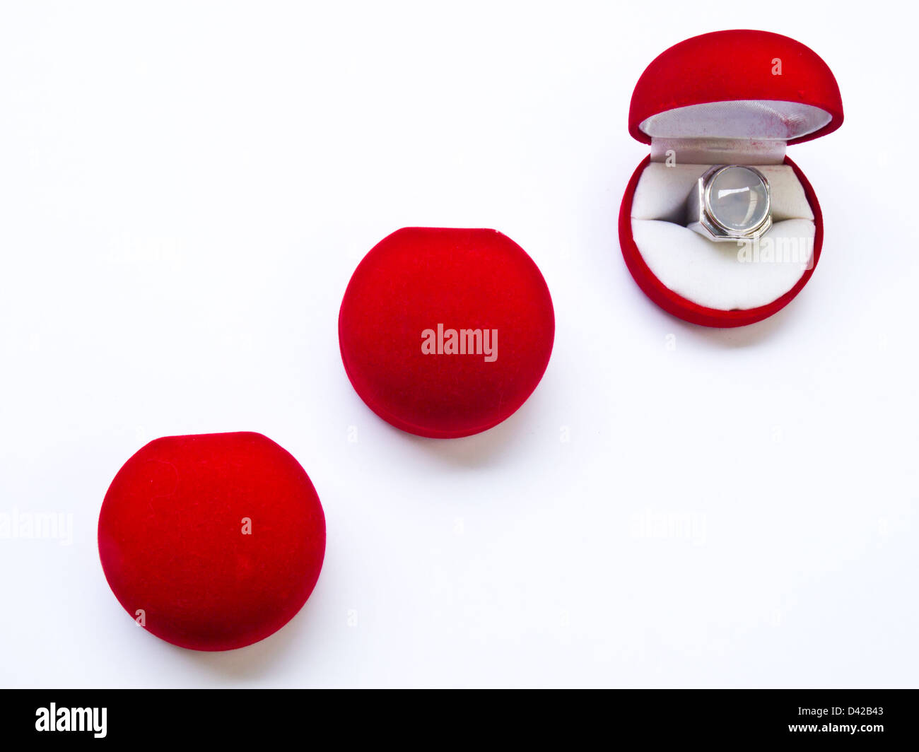 Opened round red jewelry boxes isolated on white background Stock Photo ...