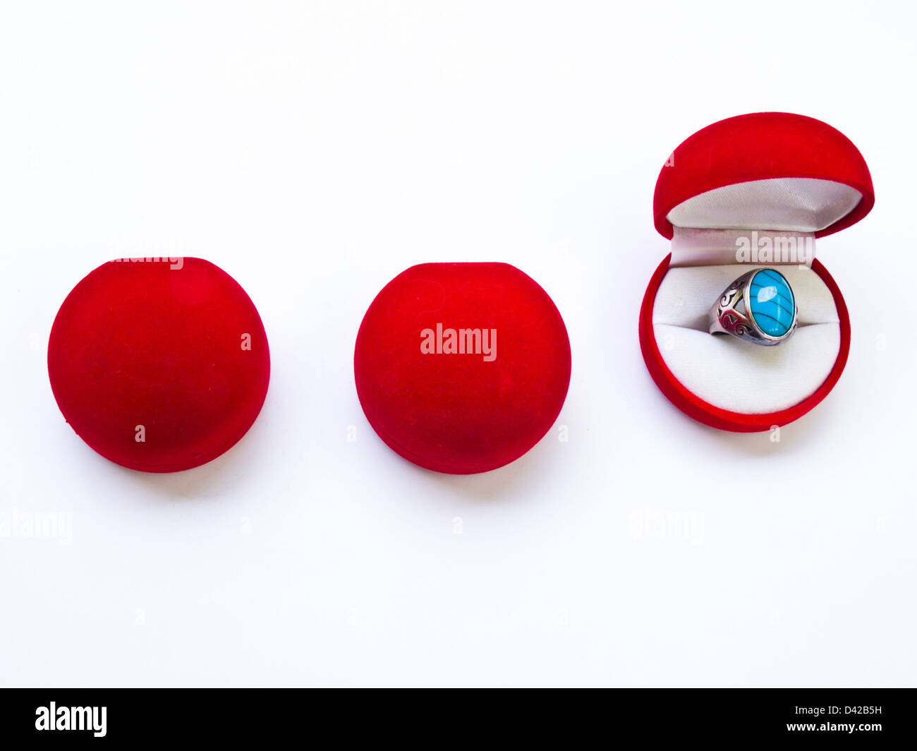 Opened round red jewelry boxes isolated on white background Stock Photo ...