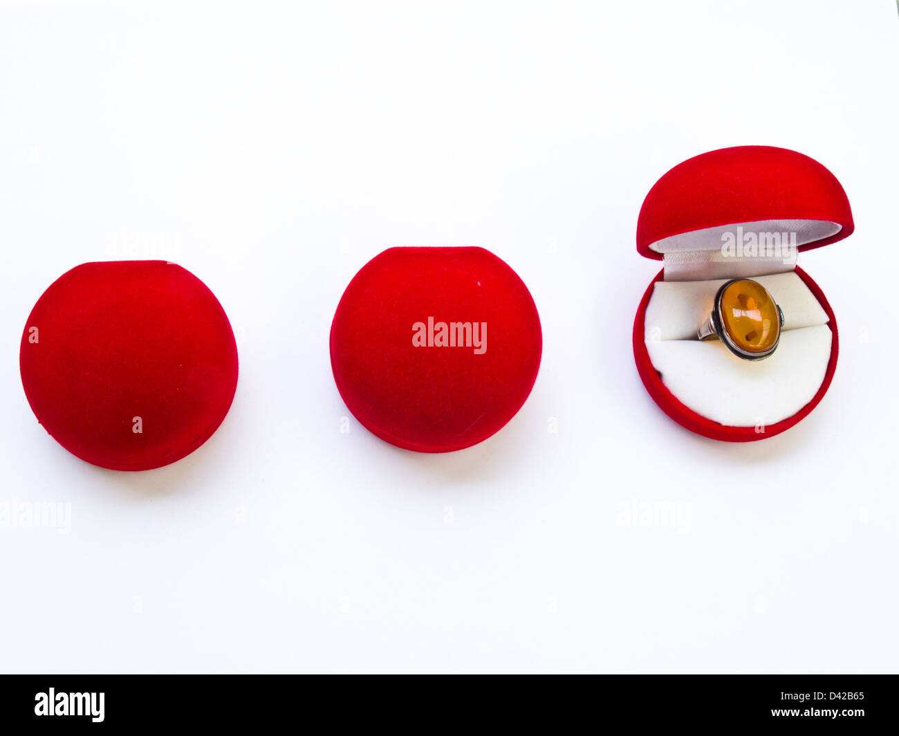 Opened round red jewelry boxes isolated on white background Stock Photo ...