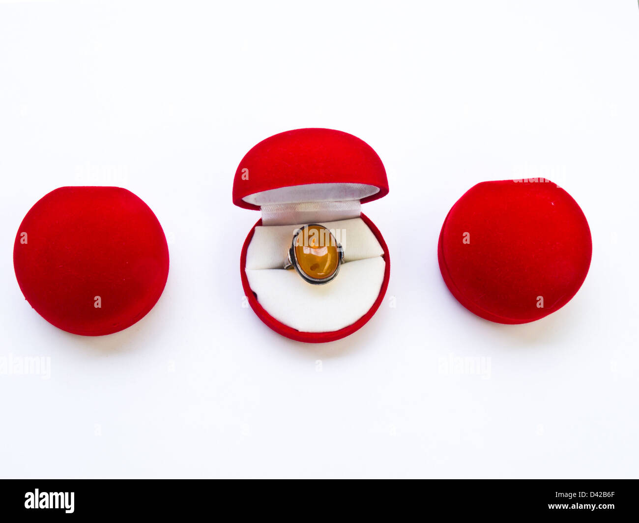 Opened round red jewelry boxes isolated on white background Stock Photo ...