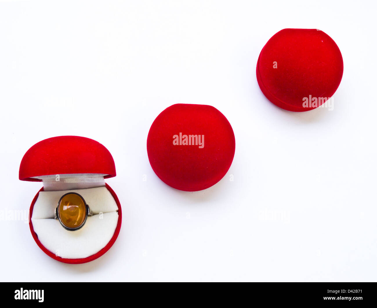 Opened round red jewelry boxes isolated on white background Stock Photo ...