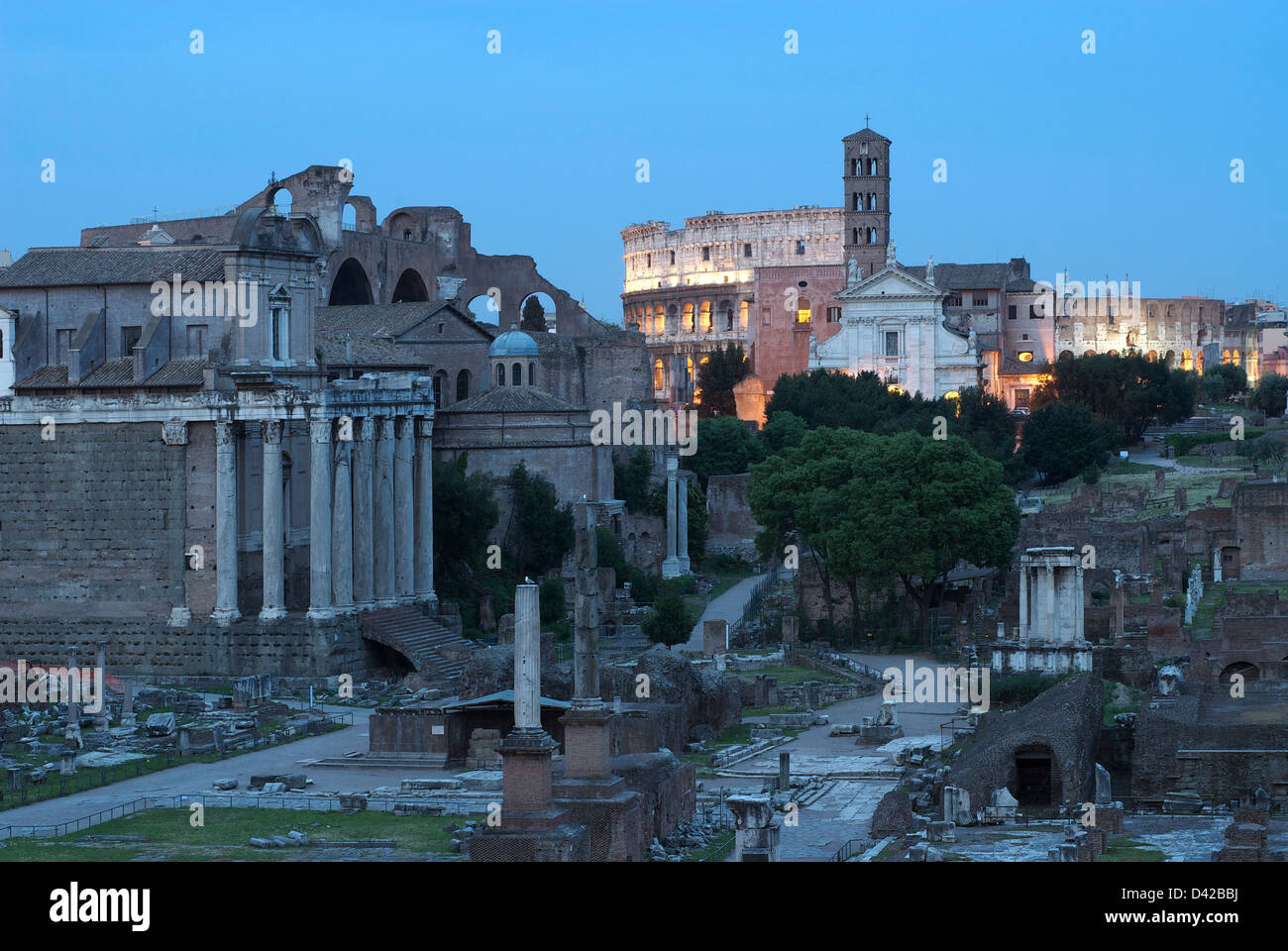 Rome, Italy, dawn over the Roman Forum with the Colosseum in the ...