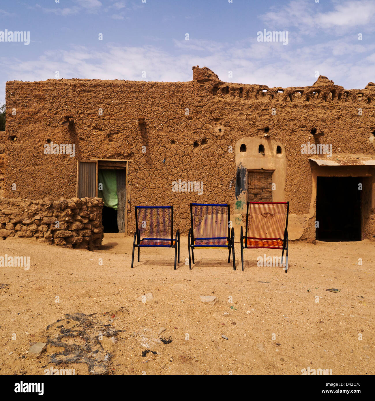Chairs in front of a typical african house hi-res stock photography and ...