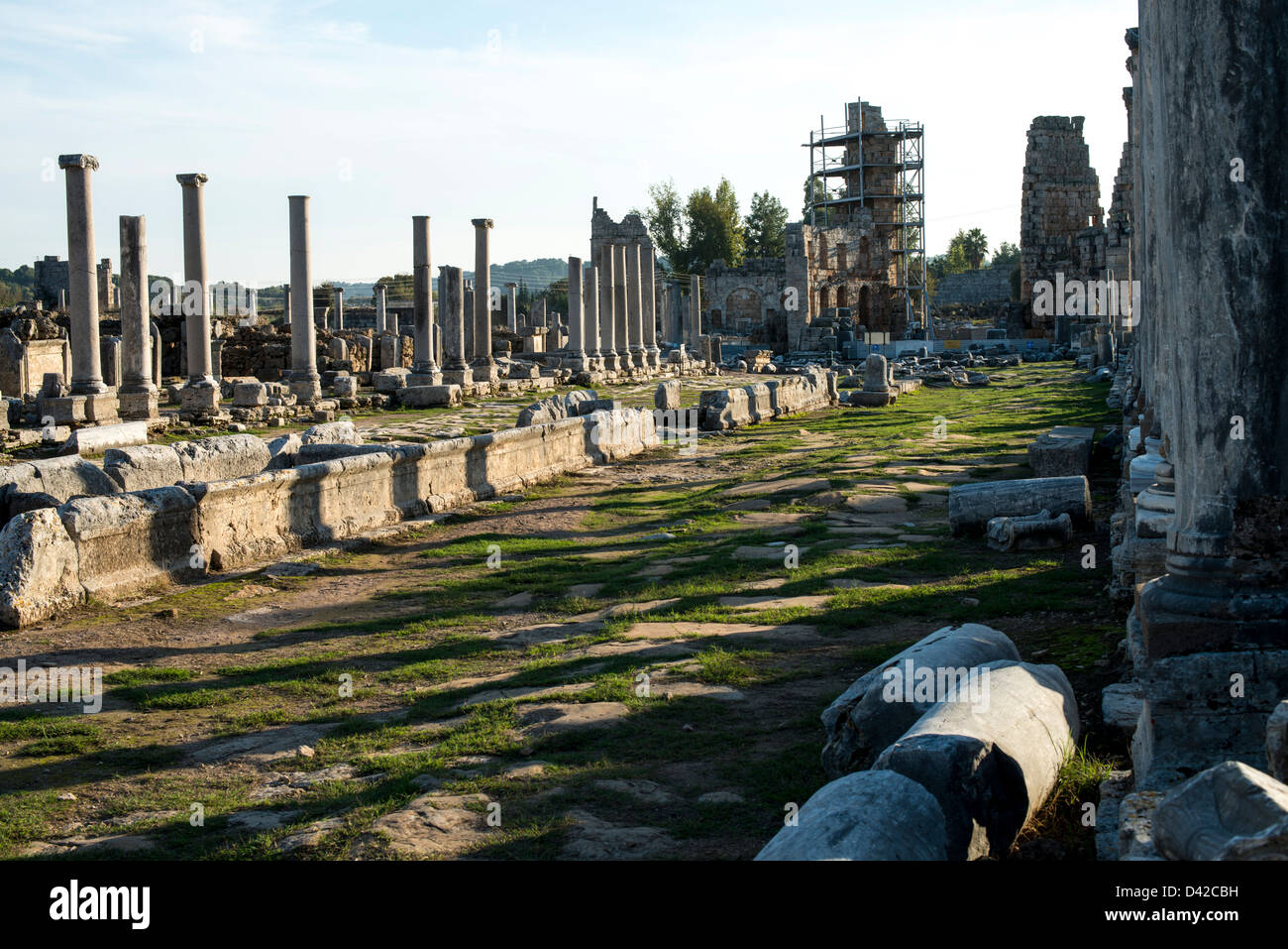 Colonnaded roman street at Perge in Turkey with a water channel running ...