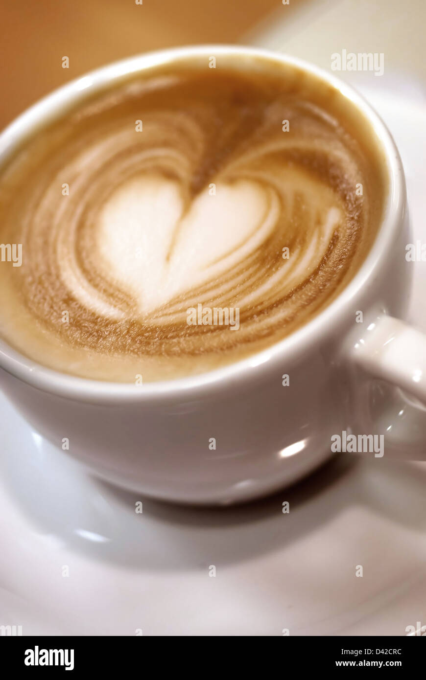 Heart formed in a cup of coffee Stock Photo - Alamy