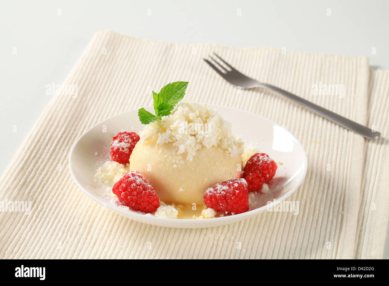 Raspberry dumpling with cottage cheese, sugar and butter Stock Photo ...