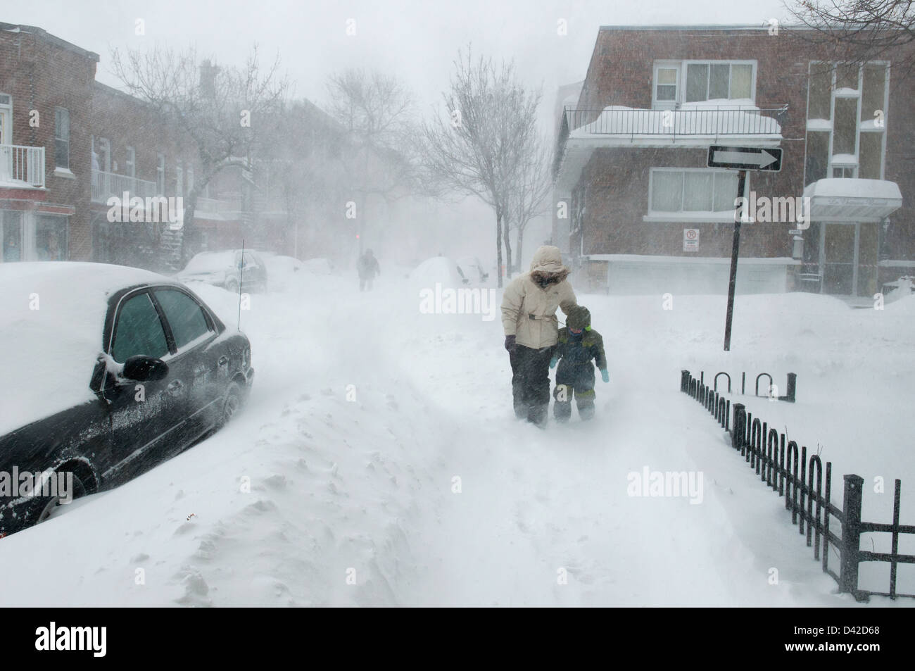 Mother and daughter walking in snowstorm Villeray area Montreal Canada ...