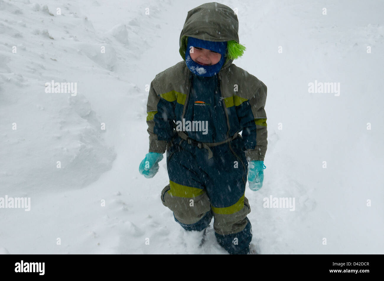 Child running in snowstorm Stock Photo - Alamy