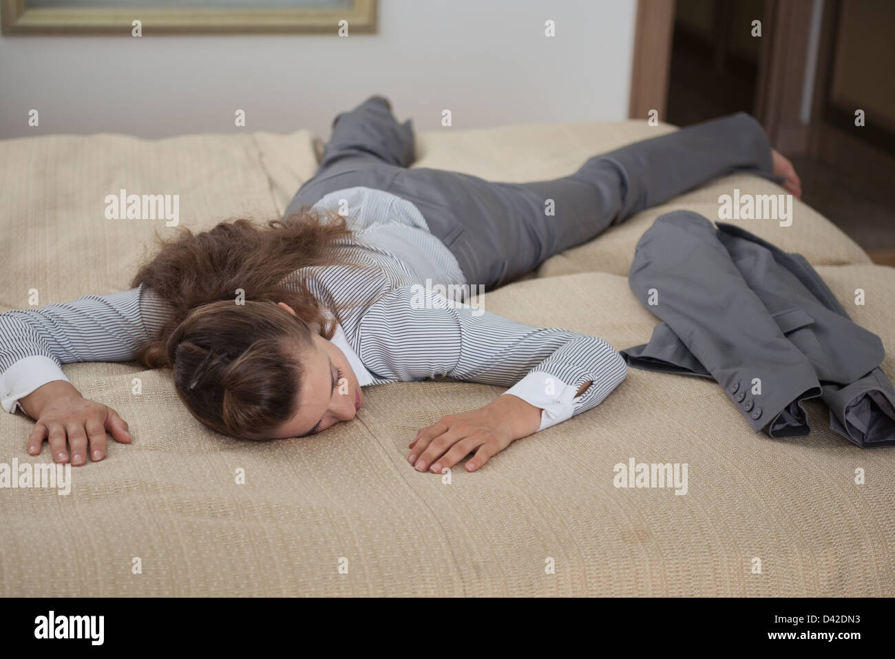 Tired business woman fall down from exhaustion in hotel room Stock ...