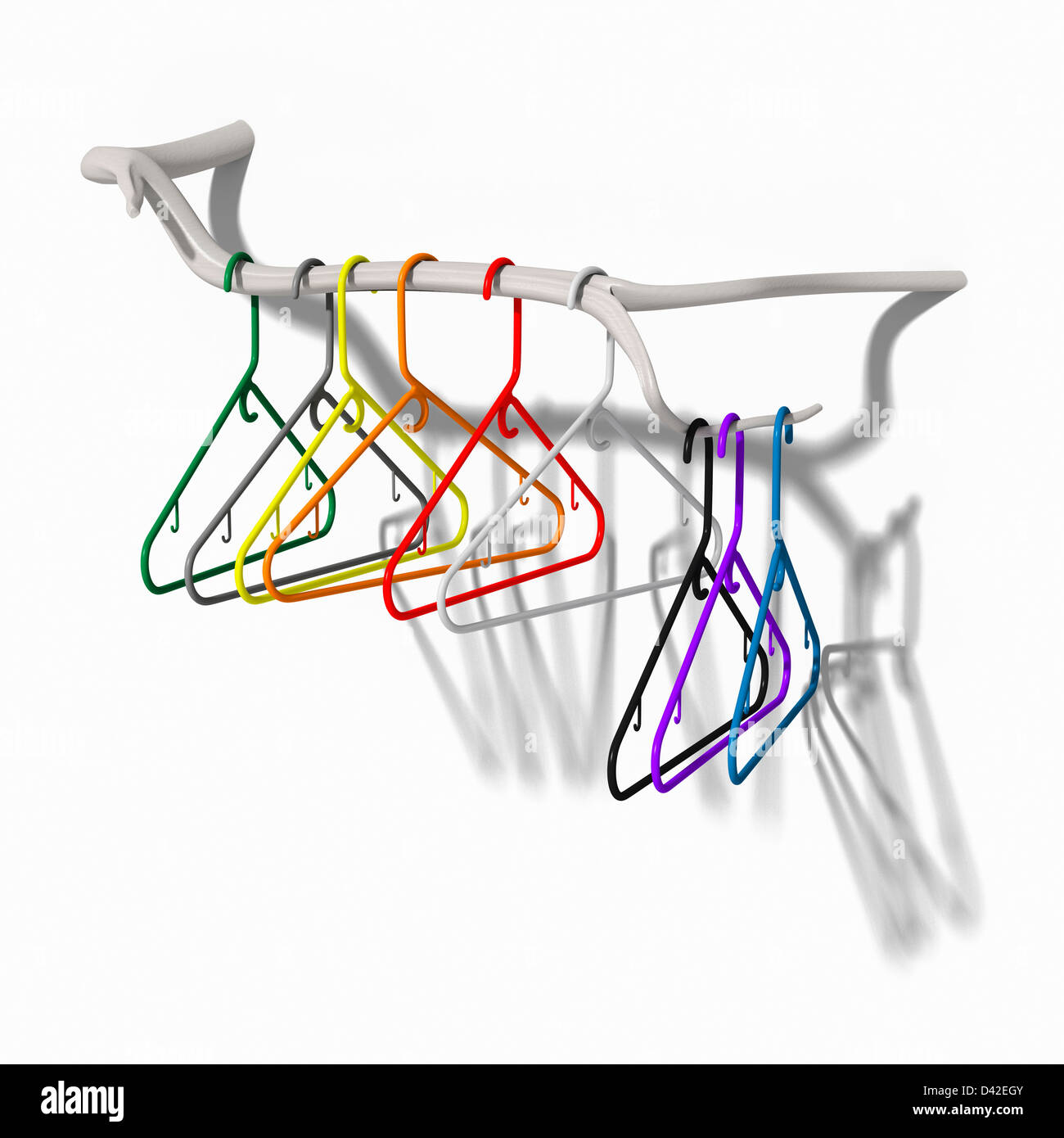White tree branch with colorful clothes hangers as organic solution to ...