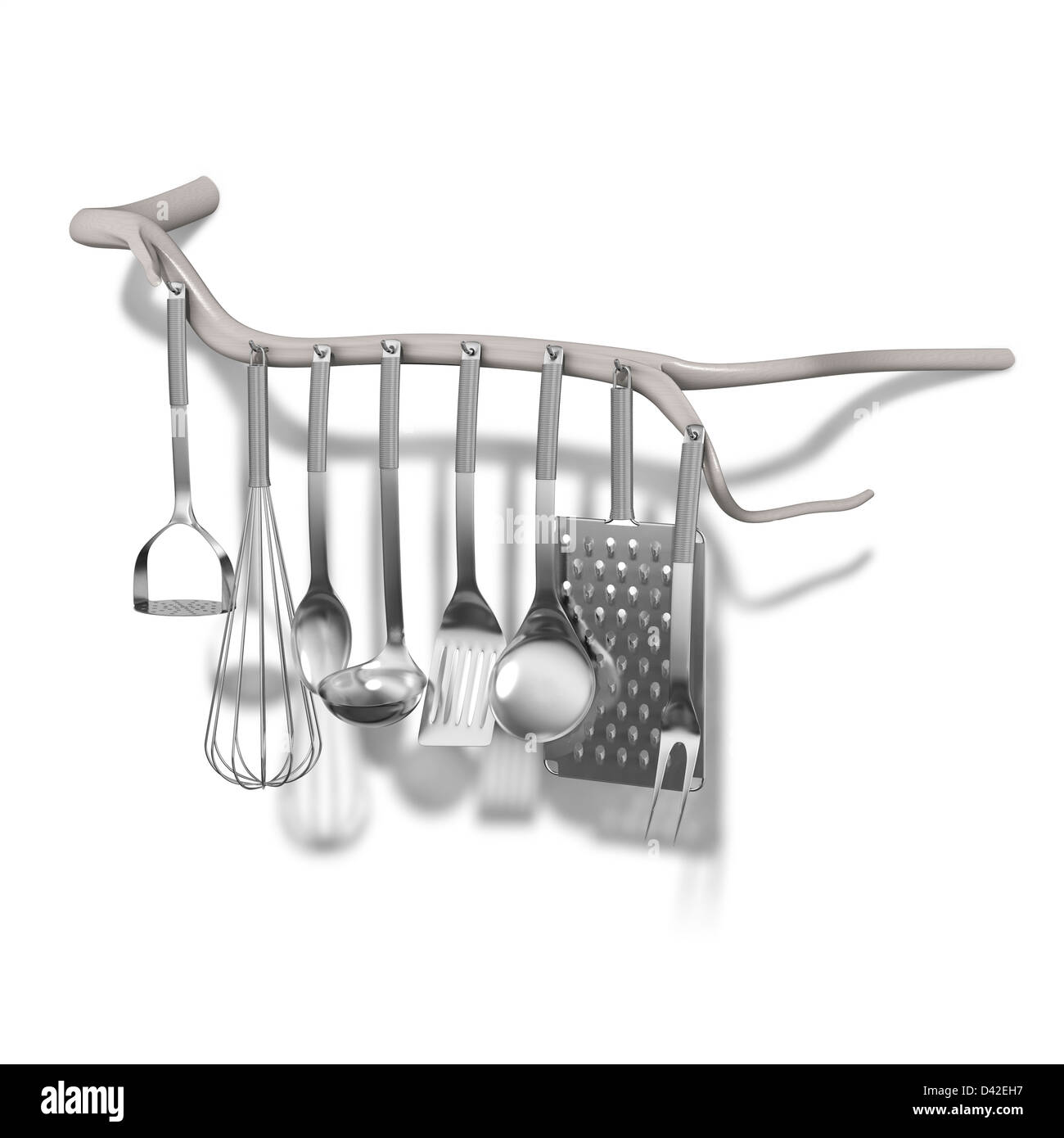 White tree branch with kitchen utensils hanging as organic solution to ...