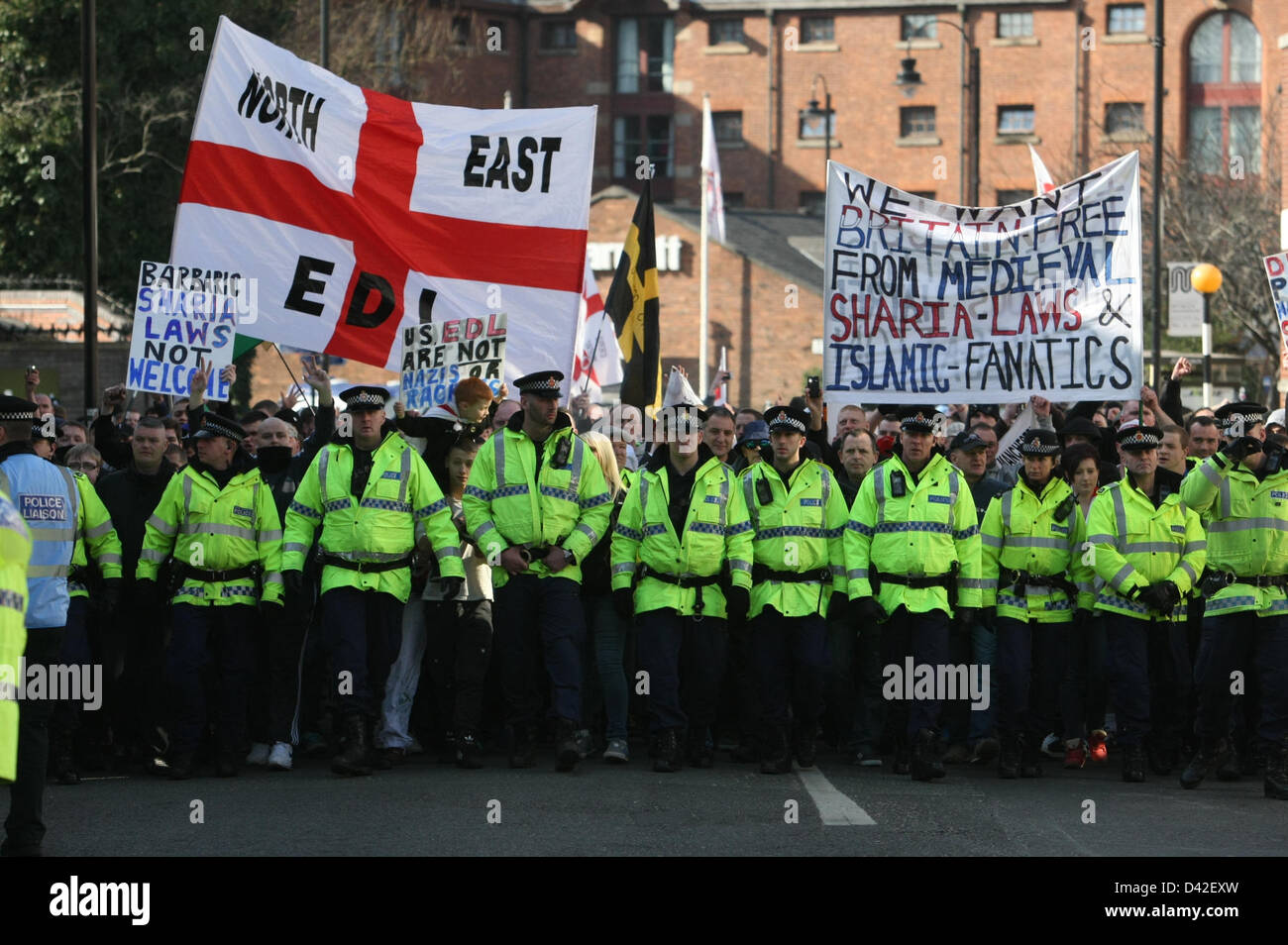 Manchester, UK 2nd March 2013, A line of police officers lead as ...
