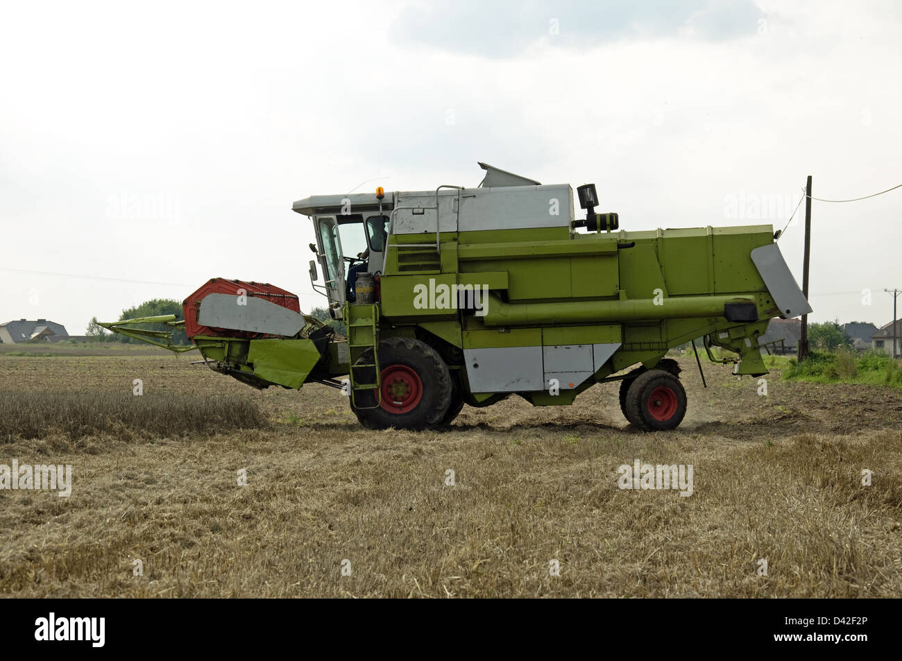 Photo of combine harvesting crops Stock Photo - Alamy