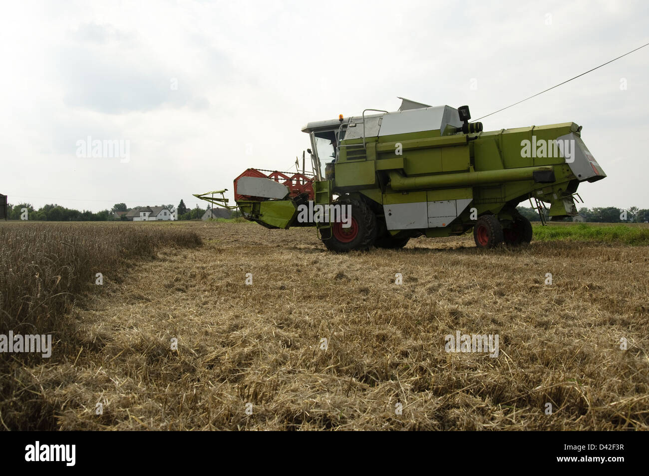Photo of combine harvesting crops Stock Photo - Alamy