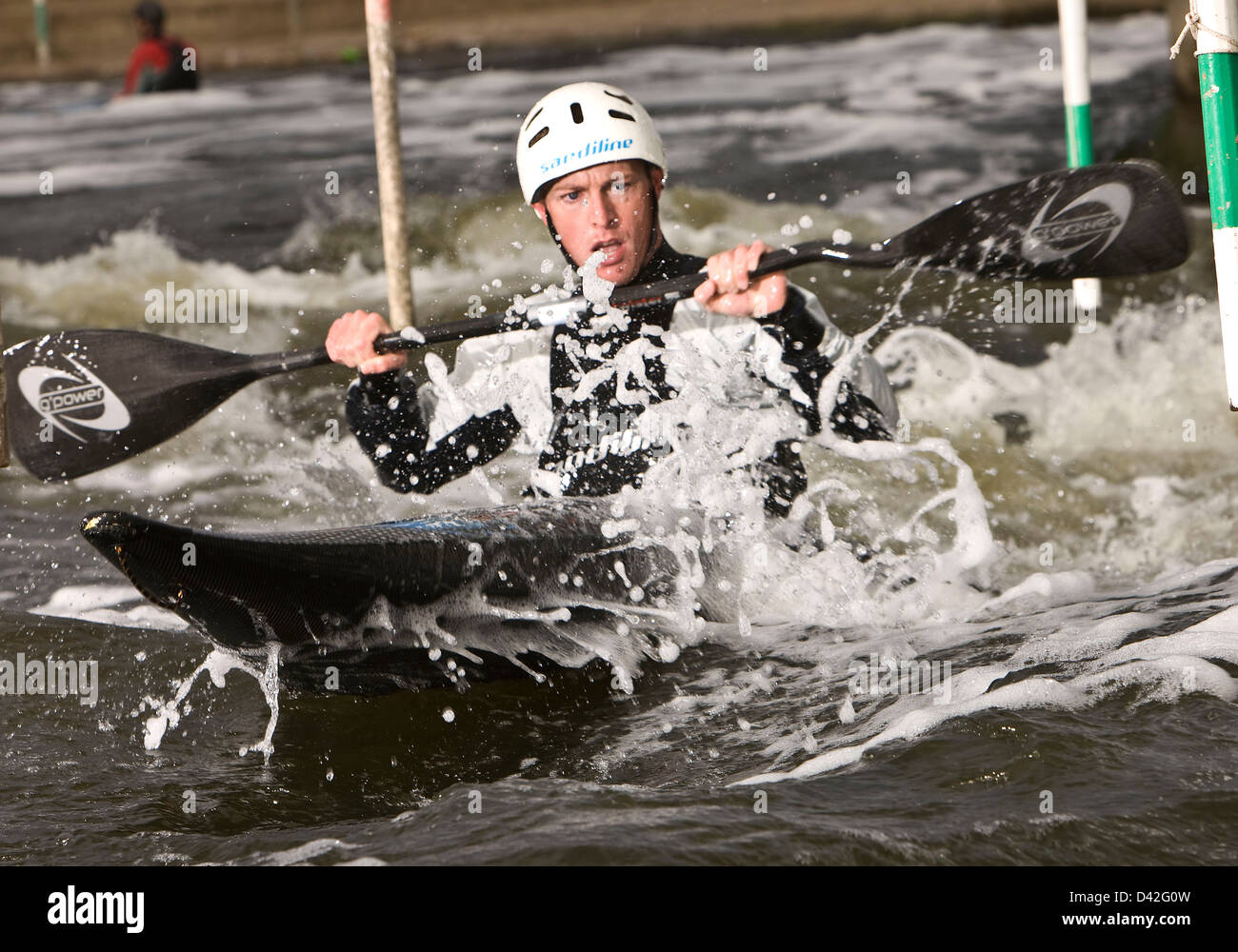 Canoer holding paddle to balance in fast water Stock Photo - Alamy