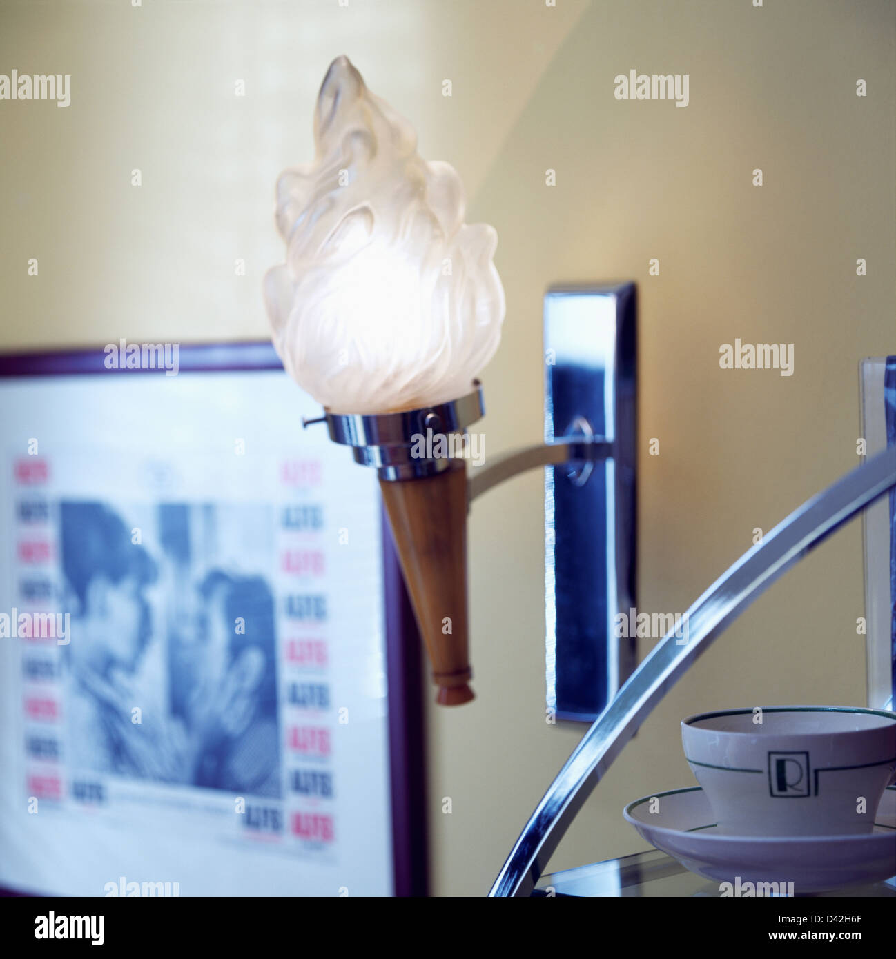 Close-up of glass flame-shaped wall light Stock Photo - Alamy