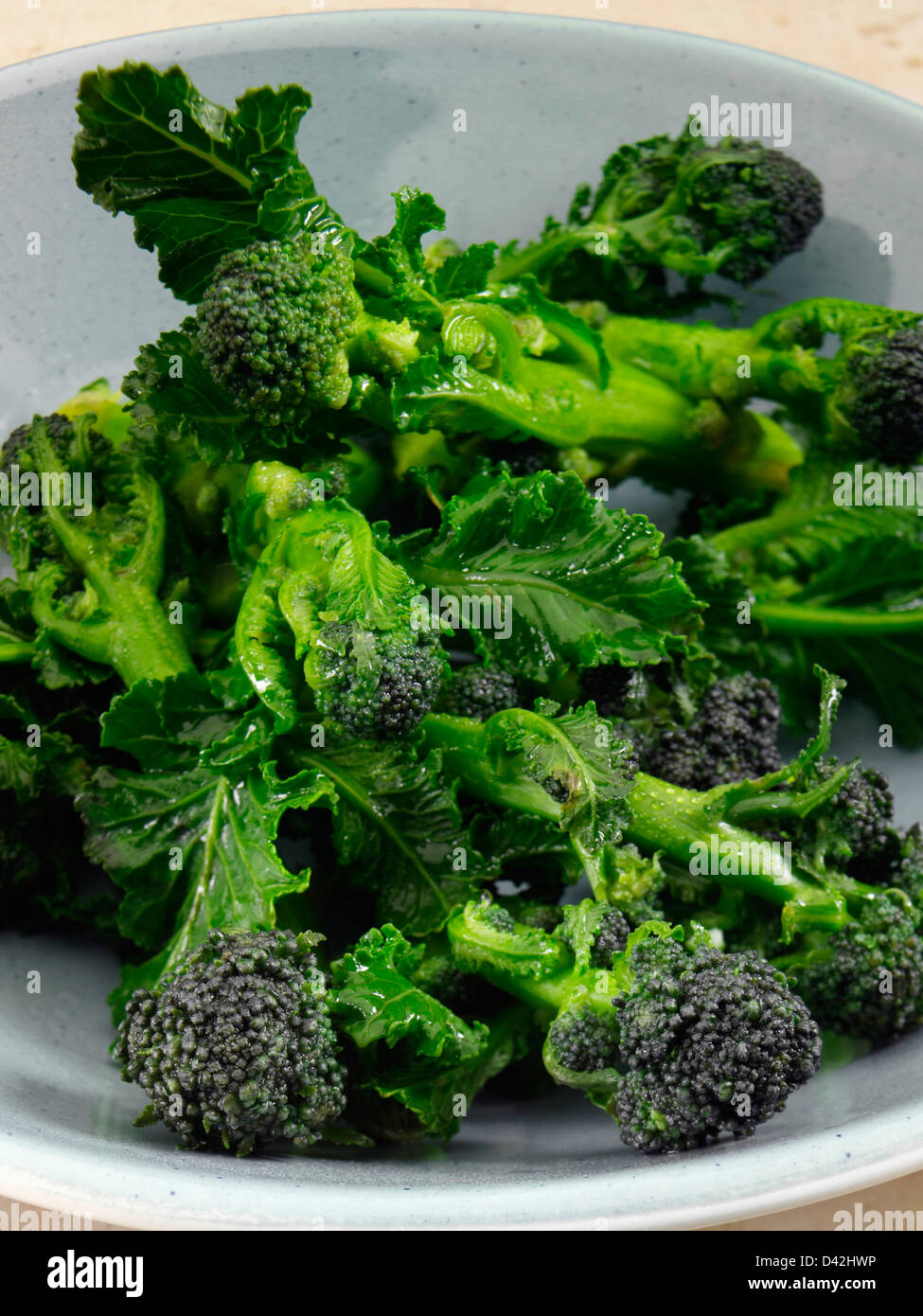 Purple sprouting broccoli cooked Stock Photo - Alamy