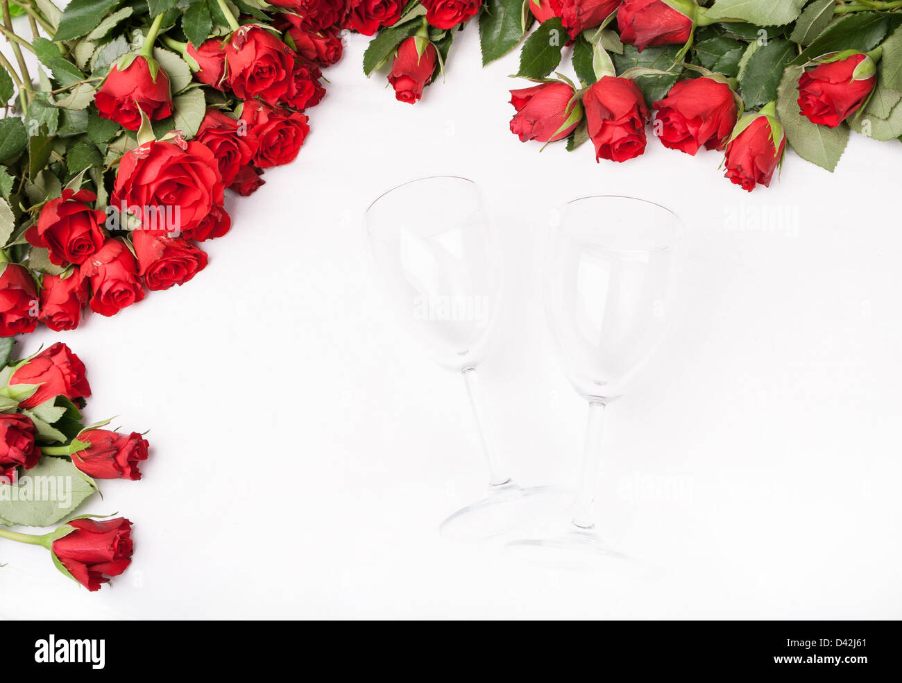 background with red roses and wine glass on white Stock Photo - Alamy