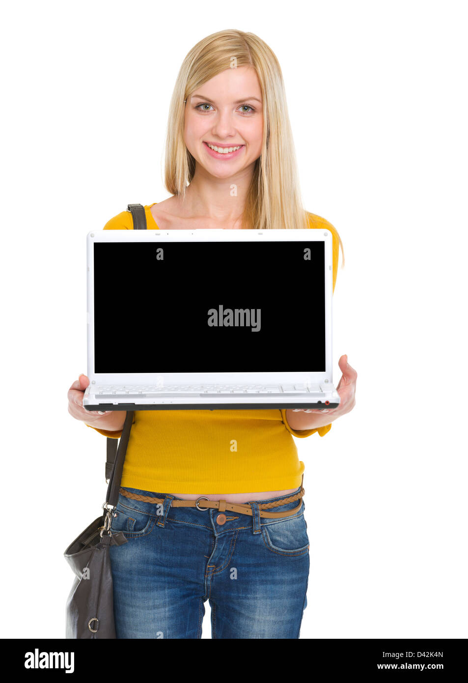 Smiling student girl showing laptop Stock Photo - Alamy