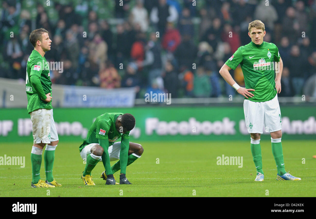 Bremer's Lukas Schmitz (L-R), Joseph Akpala and Nils Petersen gesture ...