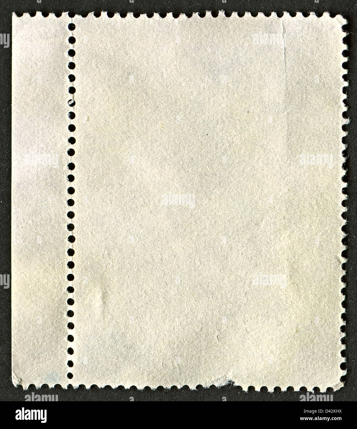 The reverse side of a postage stamp Stock Photo - Alamy