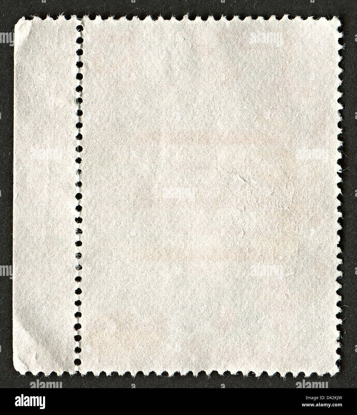 The reverse side of a postage stamp Stock Photo - Alamy