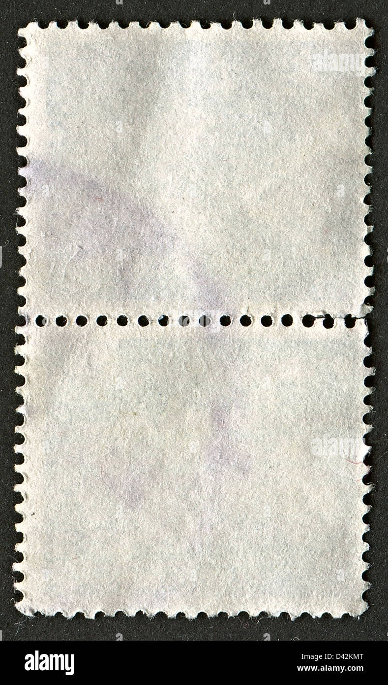 The reverse side of a postage stamp Stock Photo - Alamy