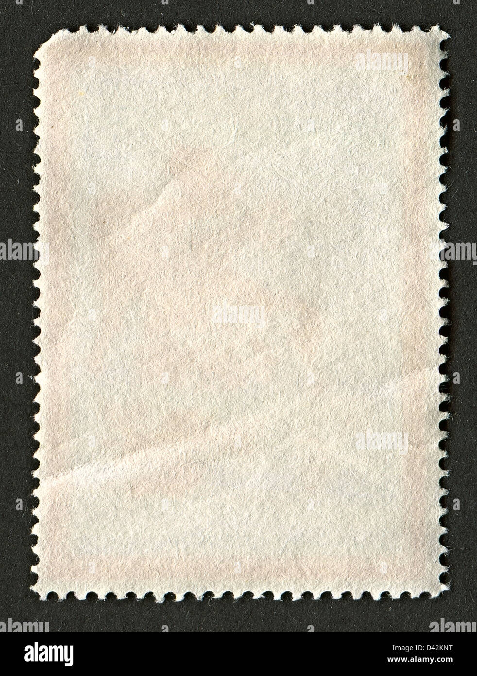 The reverse side of a postage stamp Stock Photo - Alamy