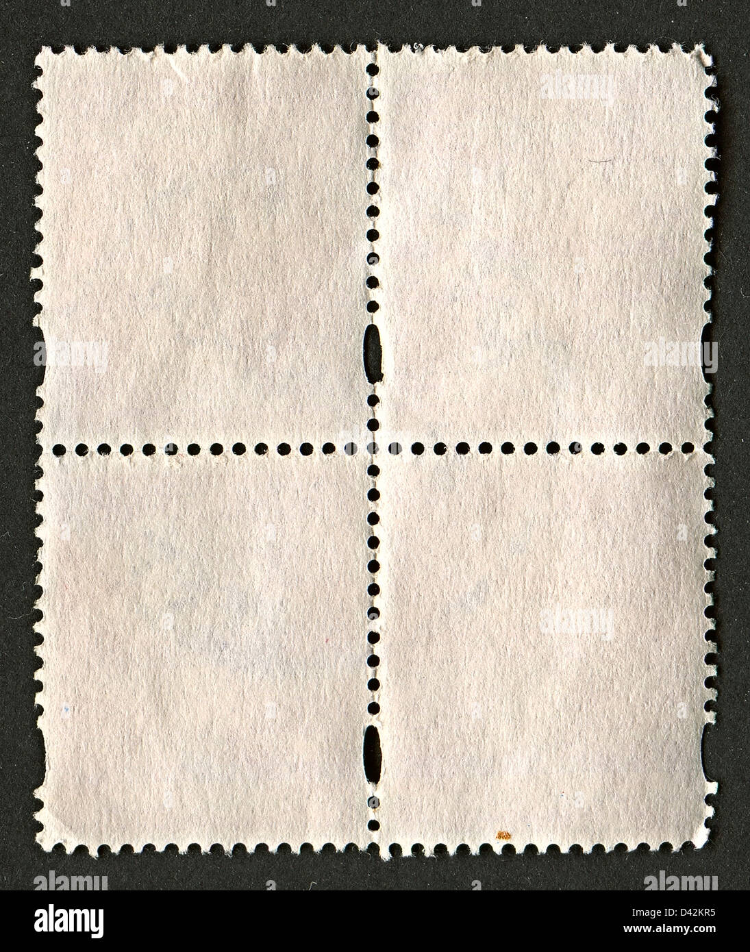 The reverse side of a postage stamp Stock Photo - Alamy