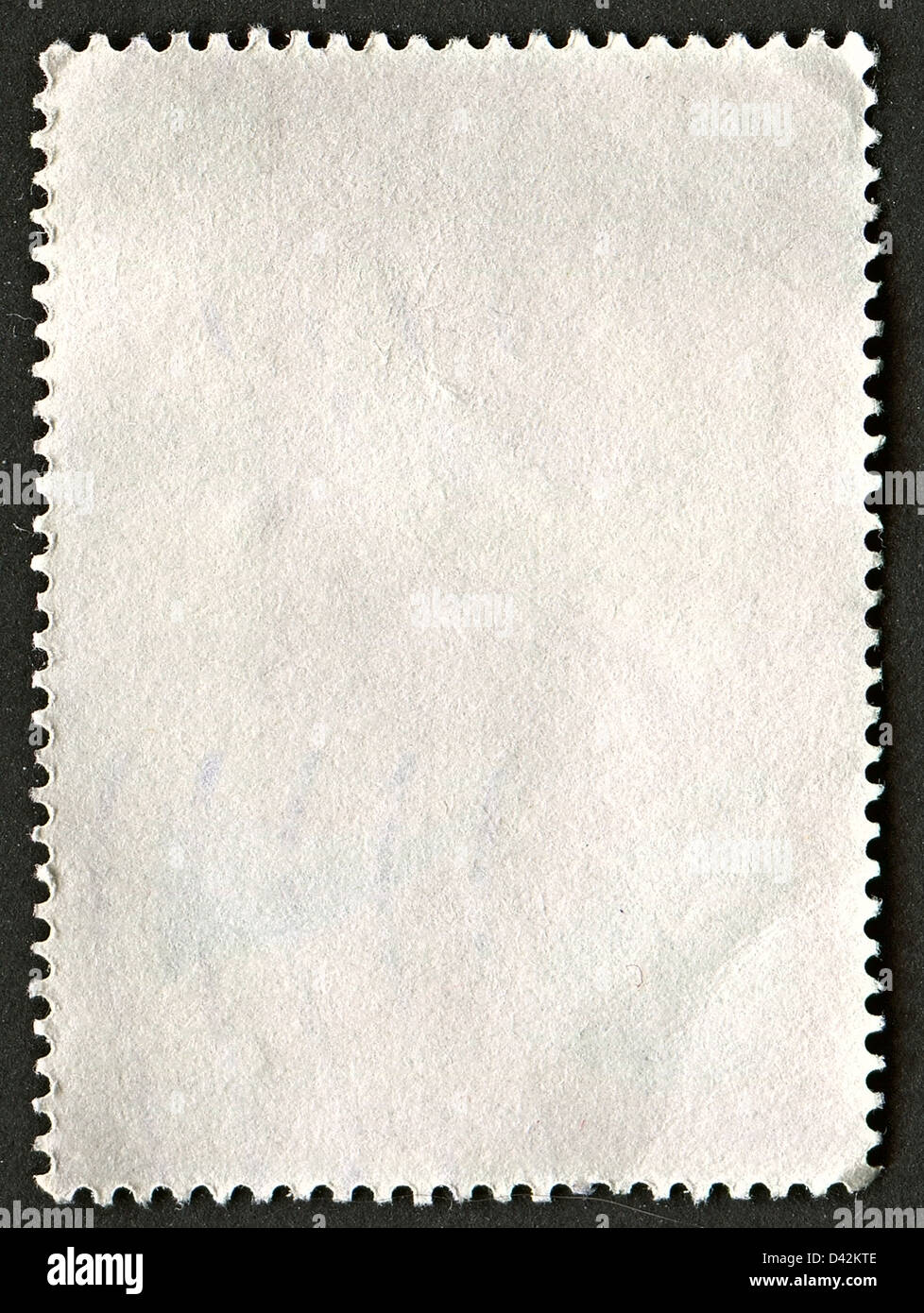 The reverse side of a postage stamp Stock Photo - Alamy