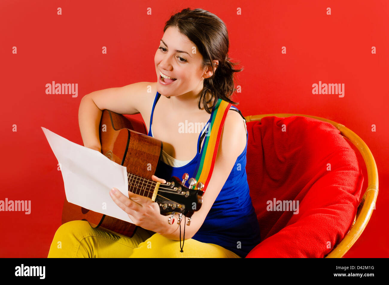 Beautiful young woman playing acoustic hi-res stock photography and ...
