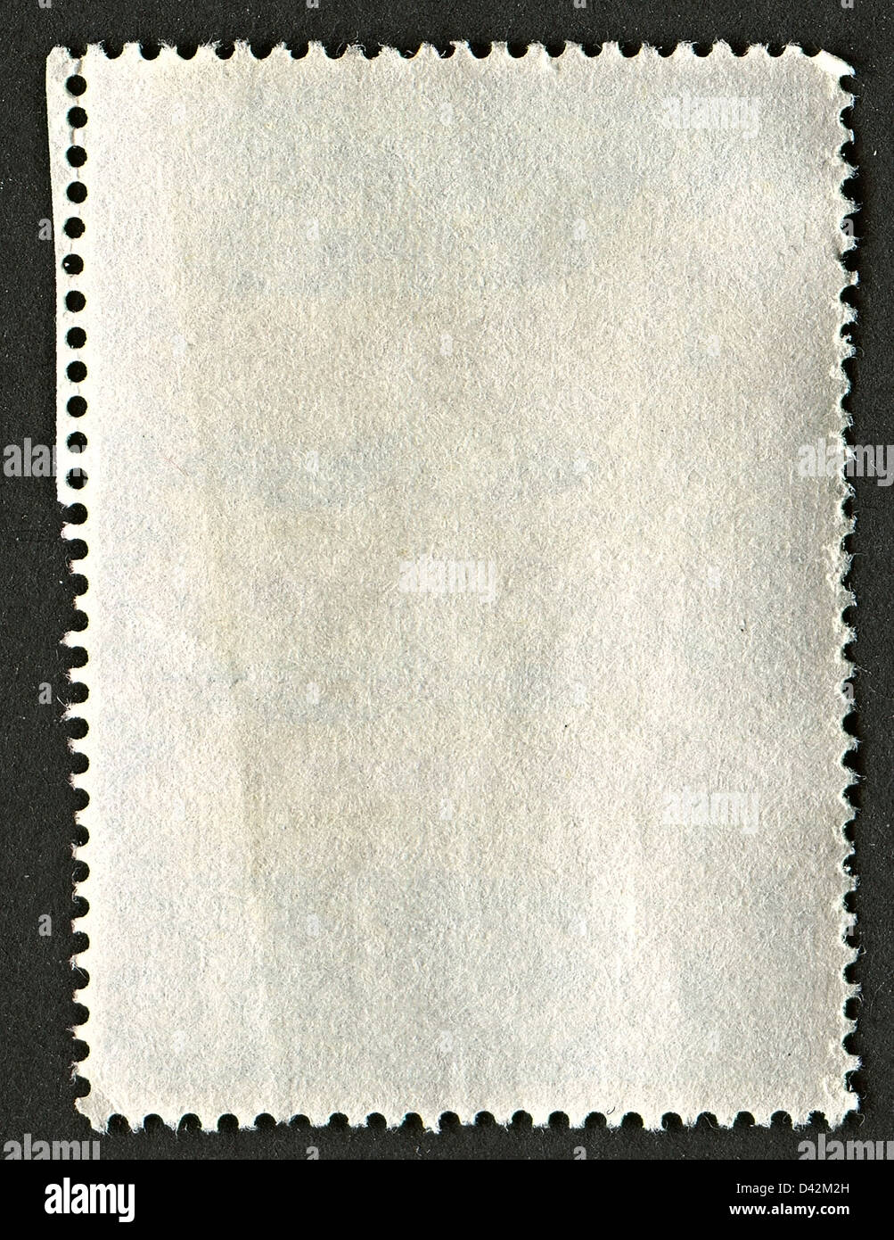 The reverse side of a postage stamp Stock Photo - Alamy