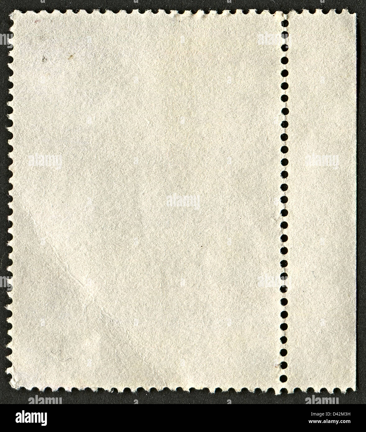 The reverse side of a postage stamp Stock Photo - Alamy