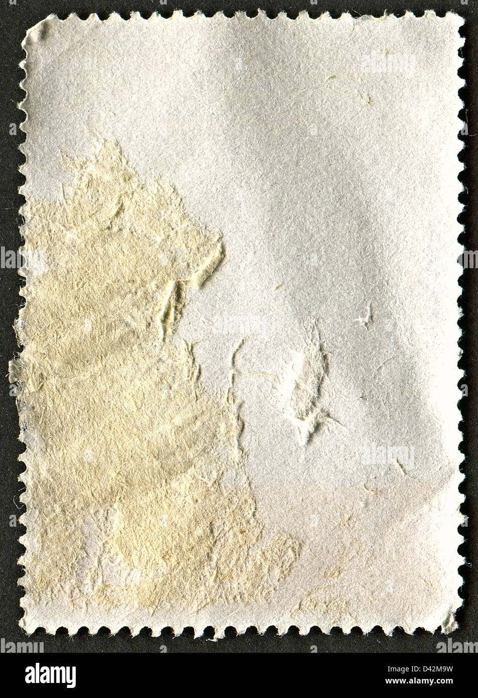 The reverse side of a postage stamp Stock Photo - Alamy