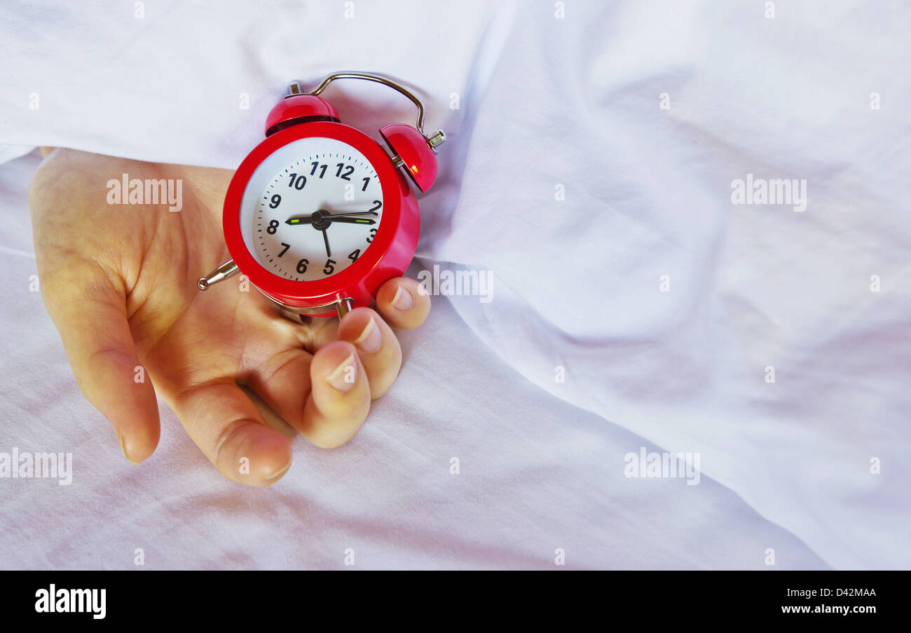 Hand On Alarm Clock High Resolution Stock Photography and Images - Alamy