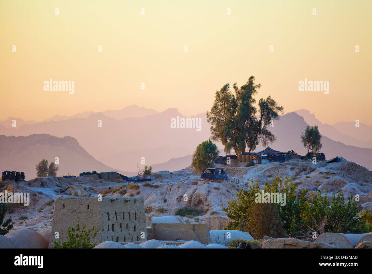 The sun sets on an Afghan National Police Outpost nestled among the ...