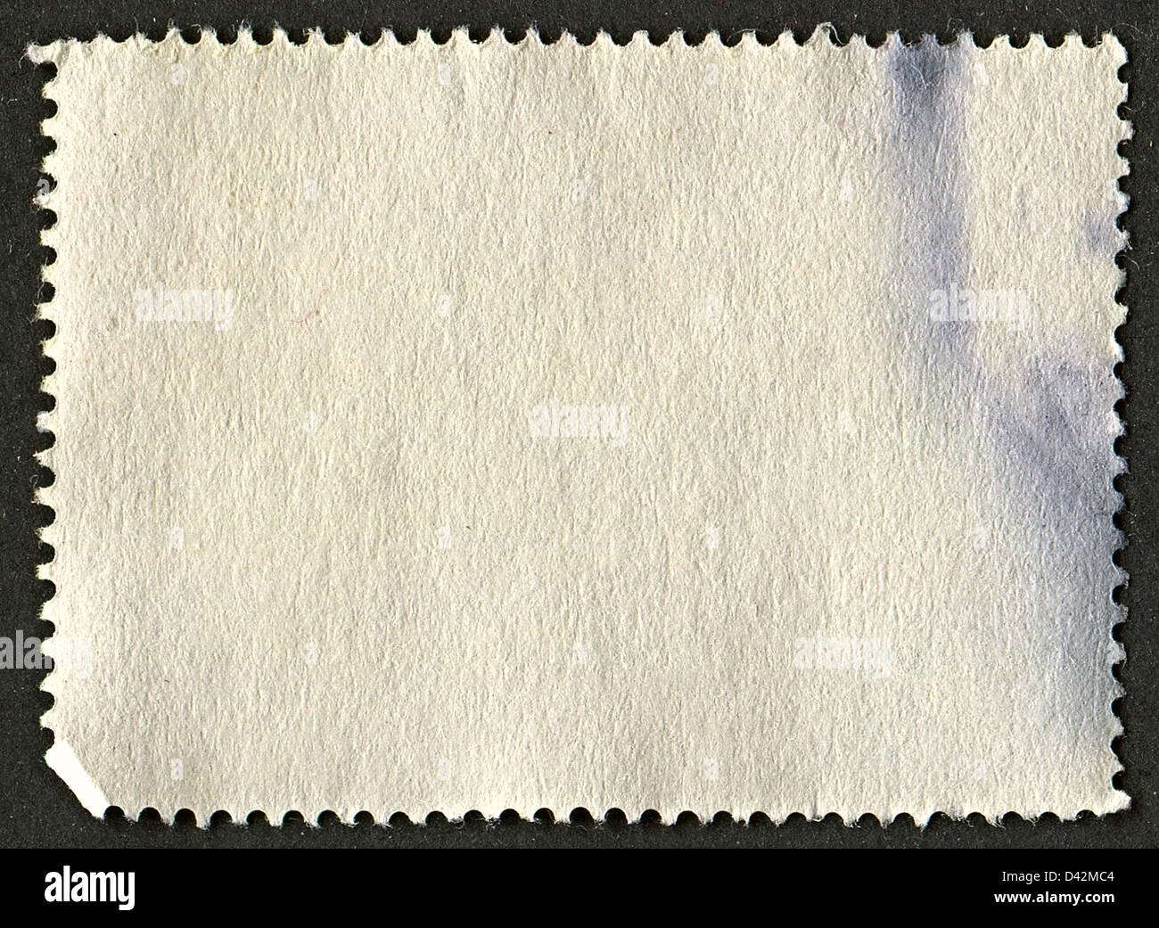 The reverse side of a postage stamp Stock Photo - Alamy