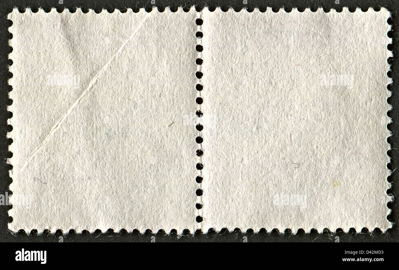 The reverse side of a postage stamp Stock Photo - Alamy