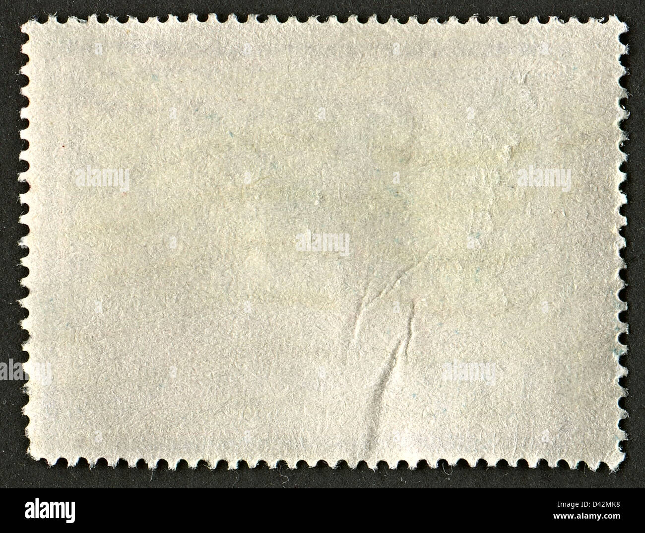 The reverse side of a postage stamp Stock Photo - Alamy