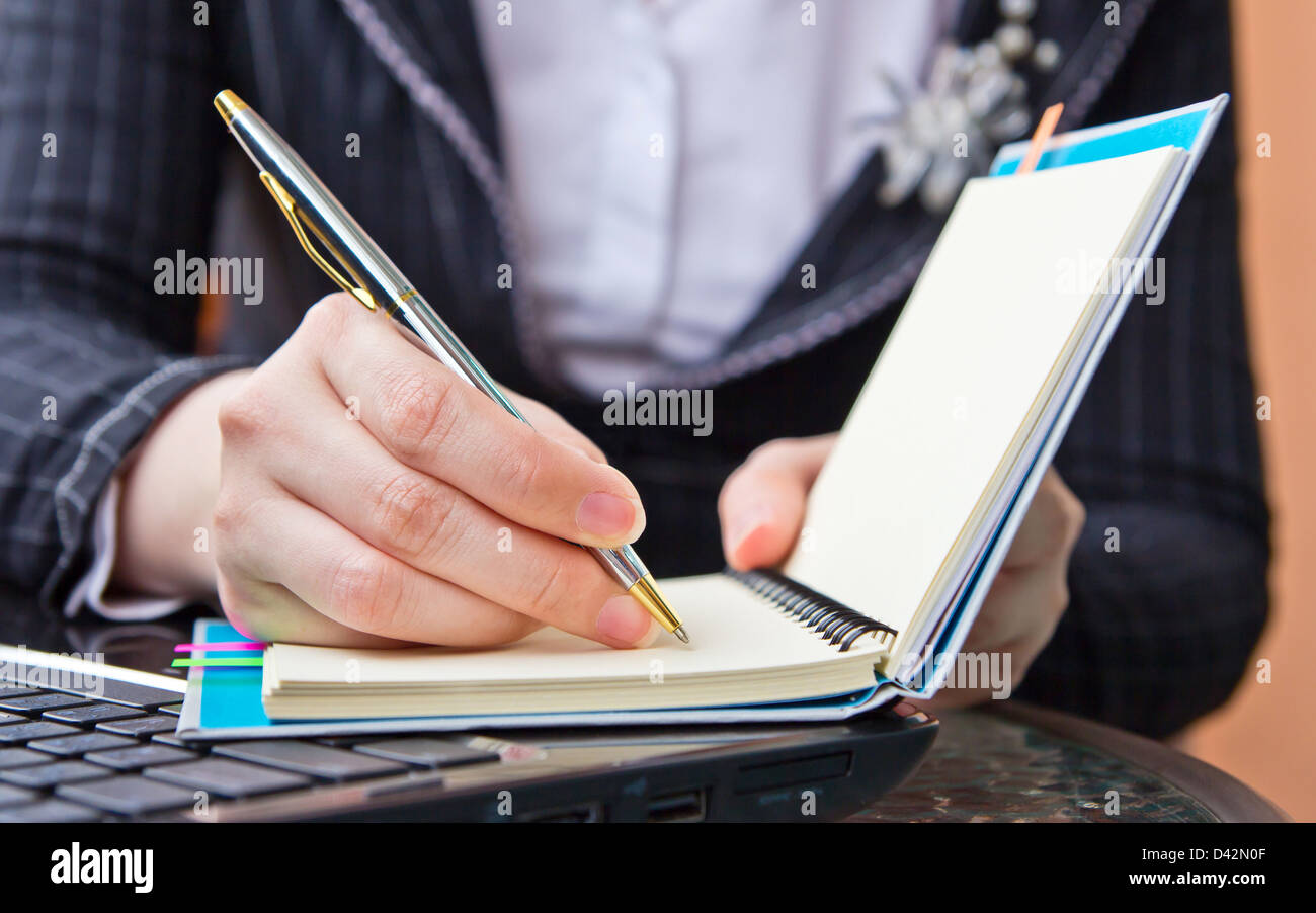 Business woman writing job Stock Photo - Alamy