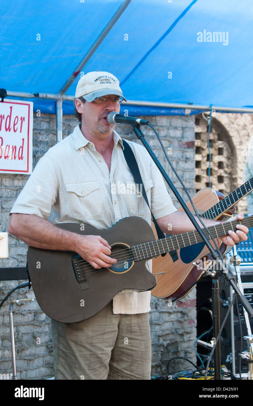Singer Playing Guitar Stock Photo - Alamy