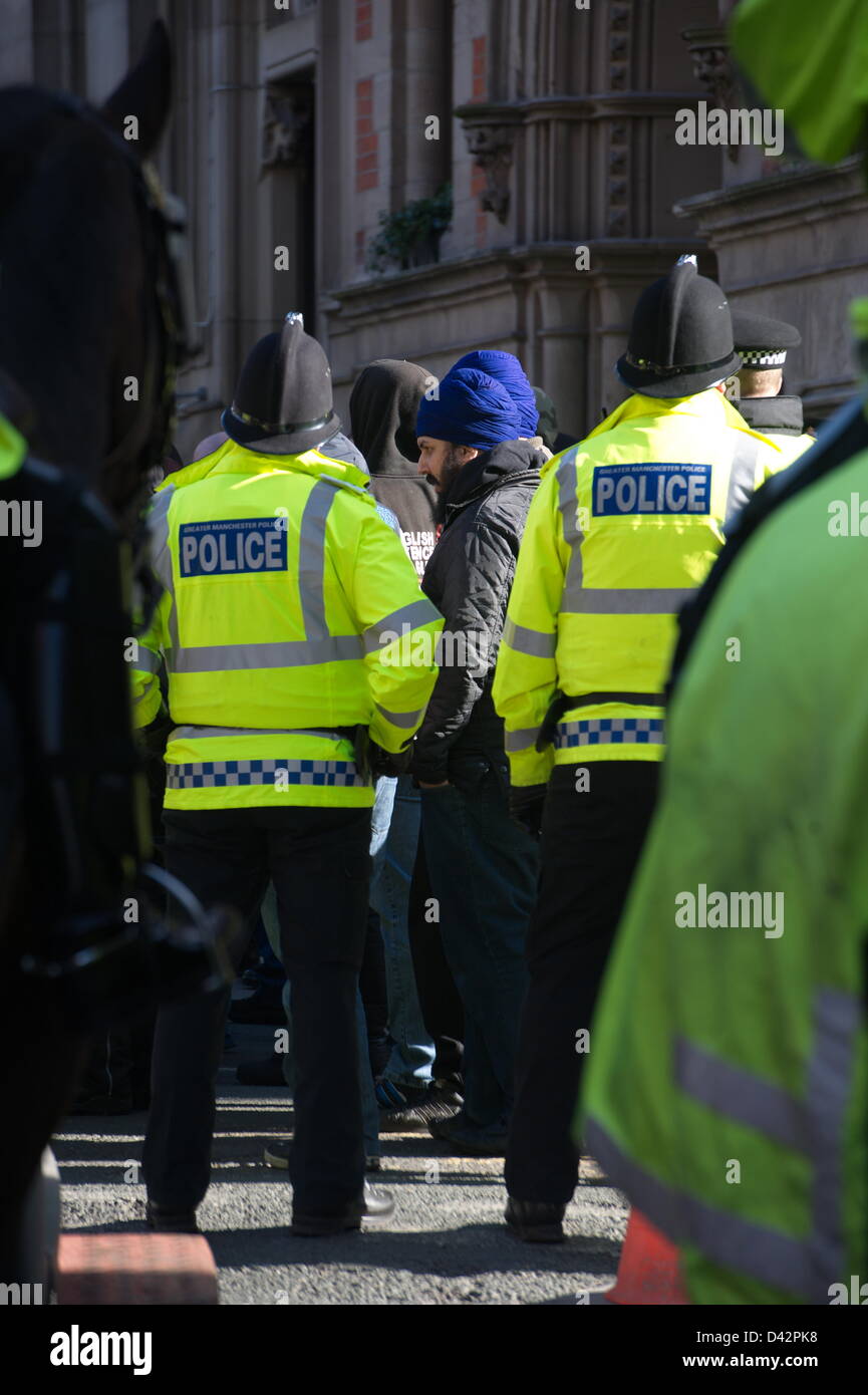 Two men wearing turbans in Sikh style enter the EDL security holding ...