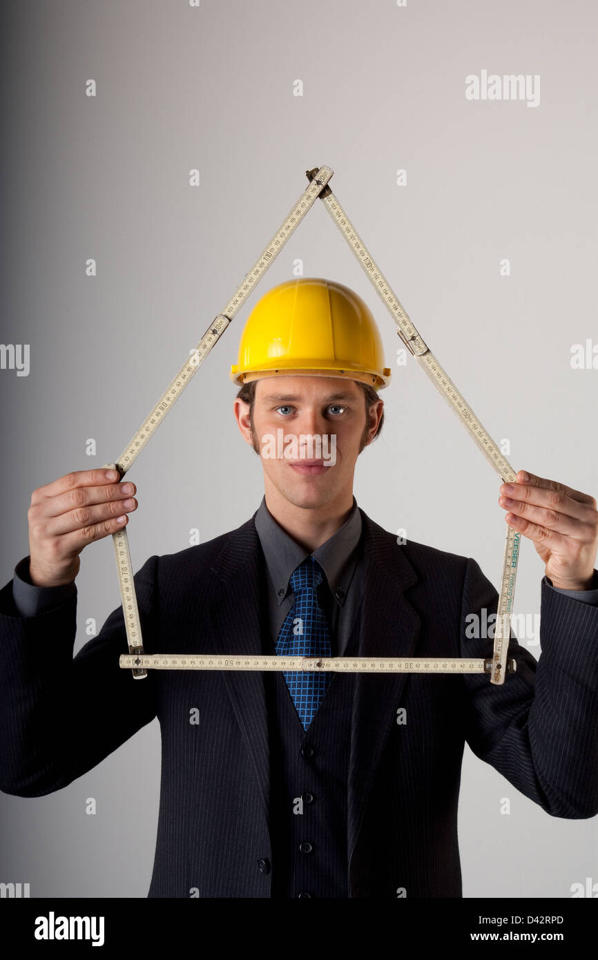 Man with ruler hi-res stock photography and images - Alamy