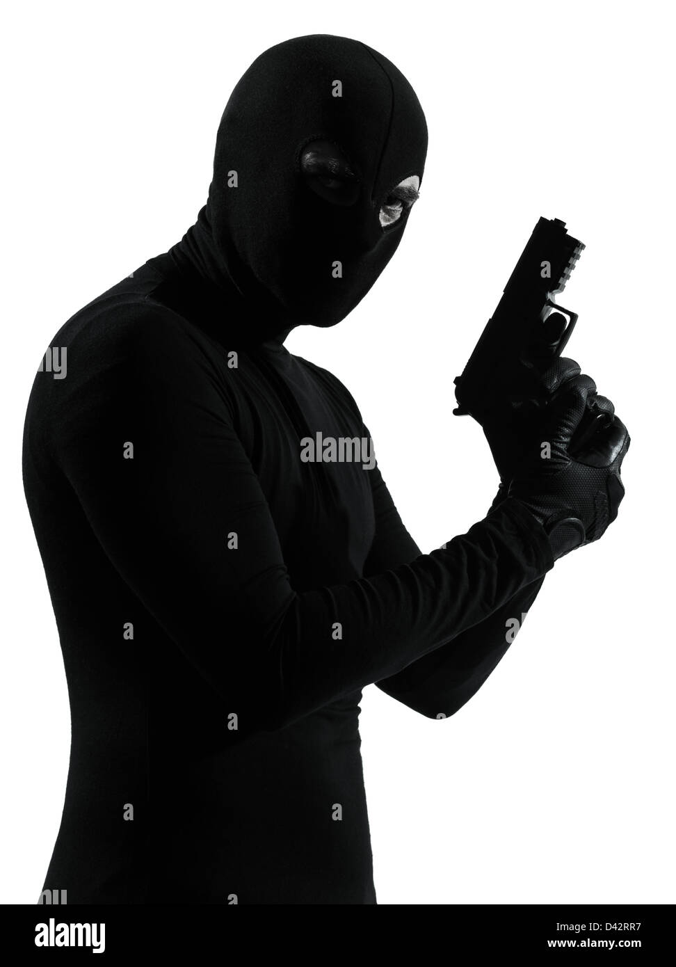 Thief criminal terrorist holding gun hi-res stock photography and ...