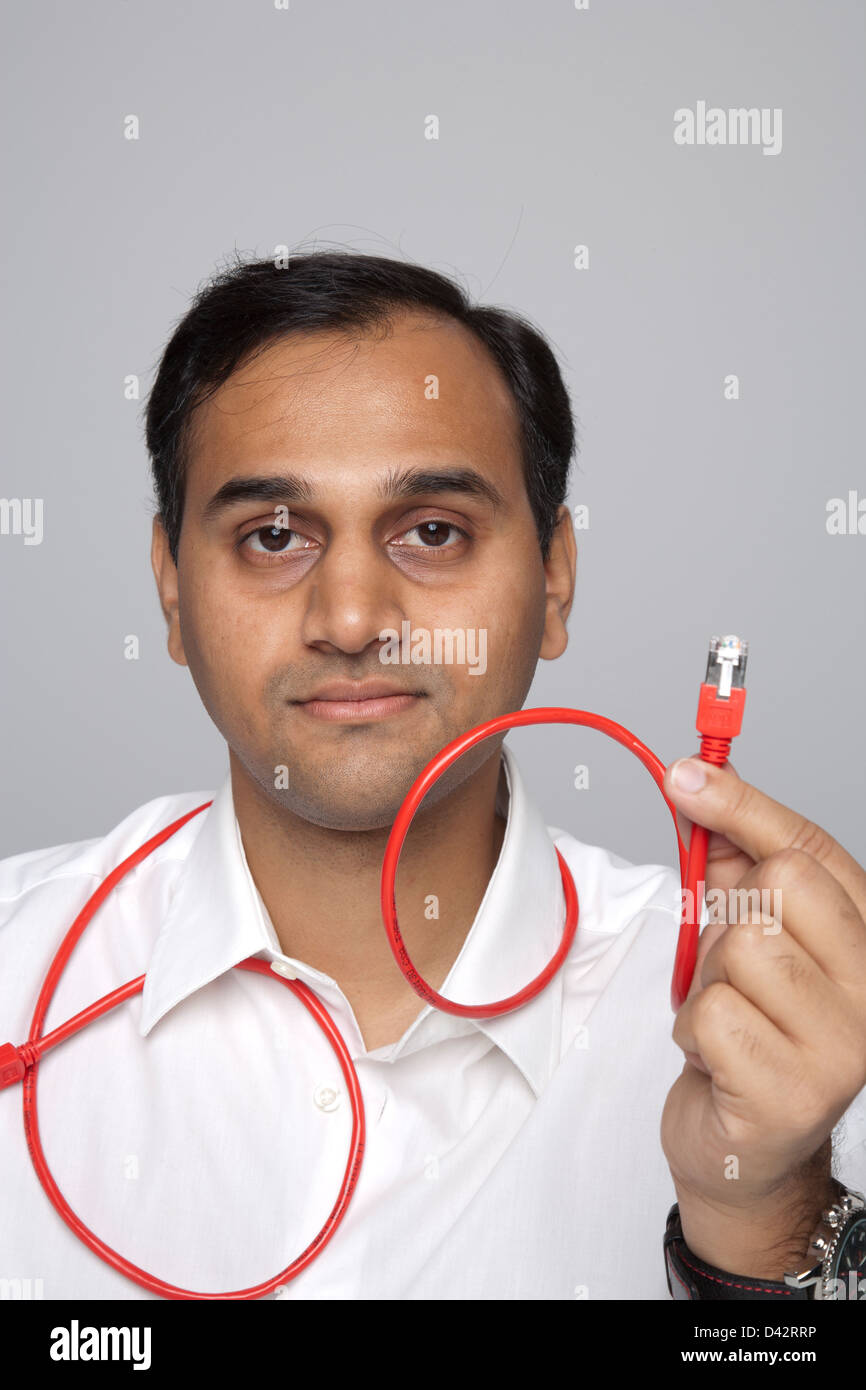 Freiburg, Germany, Indian programmers with an Ethernet cable in hand ...